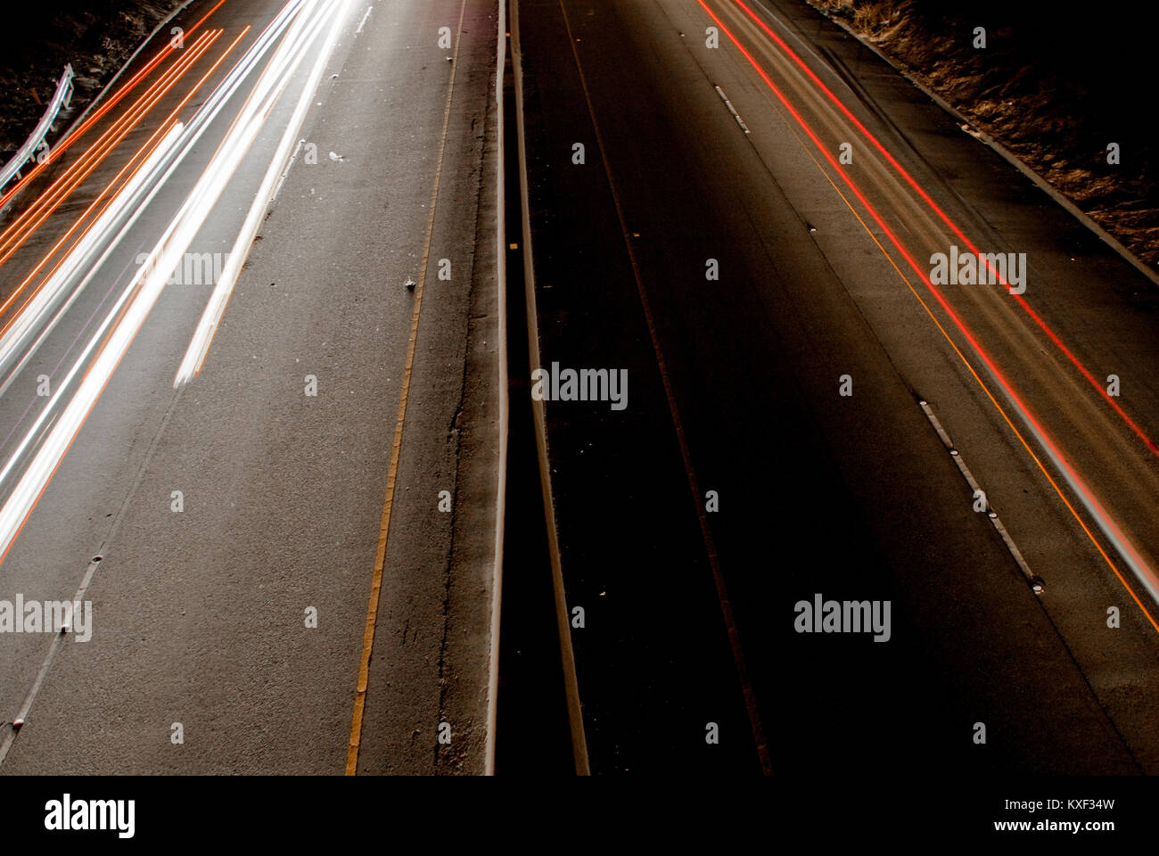 Looking down from a passover at the light trails of cars travelling ...
