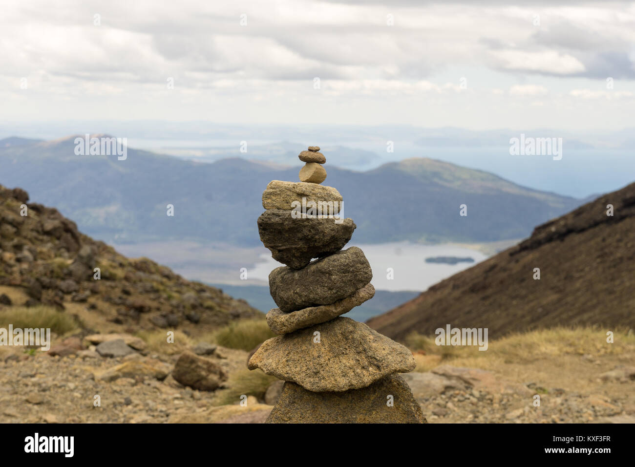 Stone tower with Lake Taupo in the background Stock Photo - Alamy