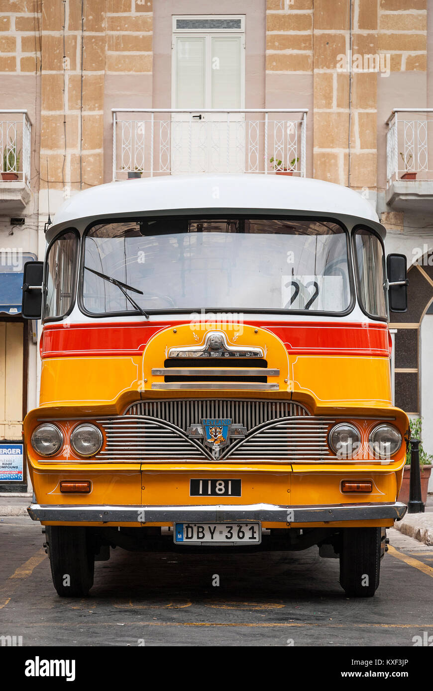 vintage orange british bedford buses on street of la valletta old town ...
