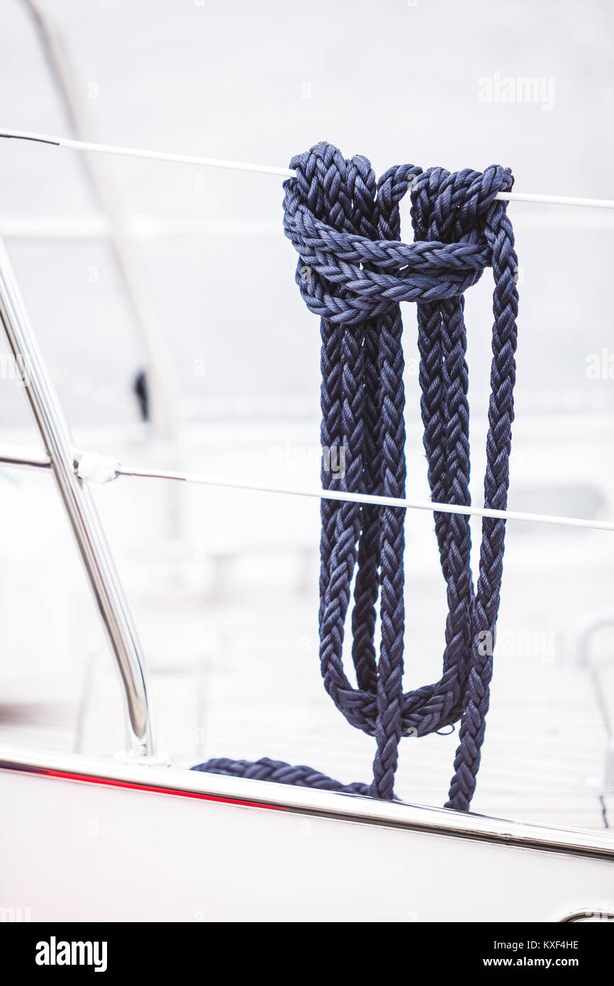 Old fashioned harbor marina sail boat ropes. Yachting details and ...