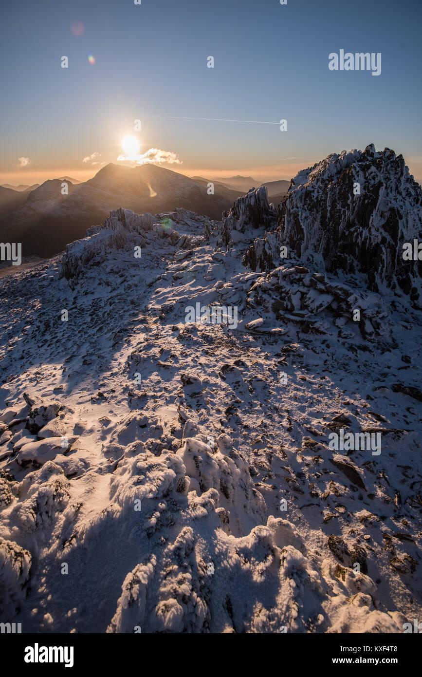 sunset over snowy summit landscape in Wales Stock Photo - Alamy