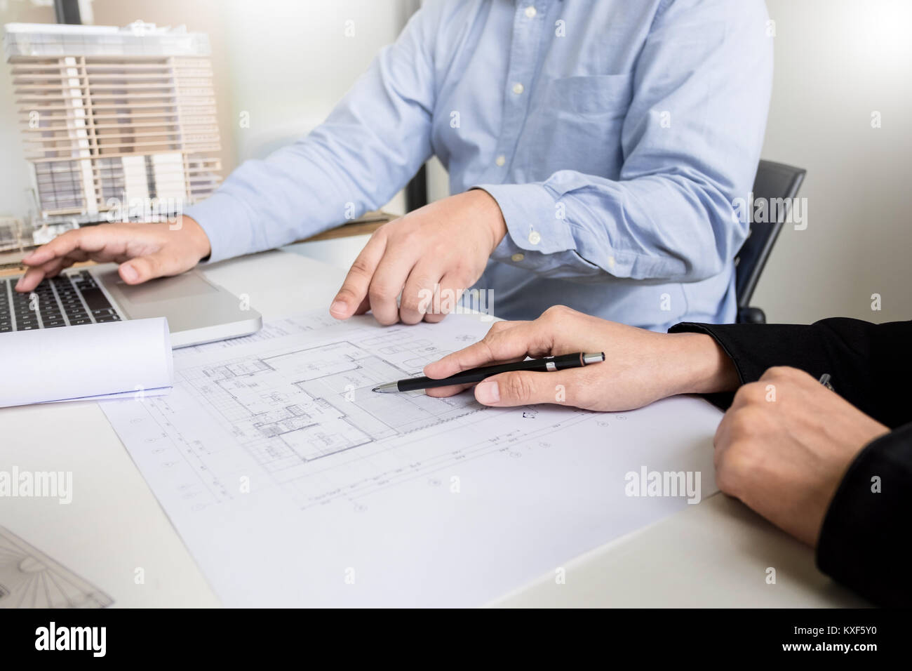 Person's engineer Hand Drawing Plan On Blue Print with architect ...