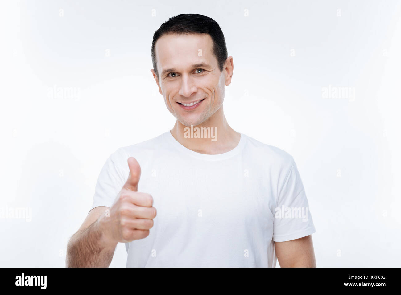 Positive nice man showing OK sign Stock Photo - Alamy