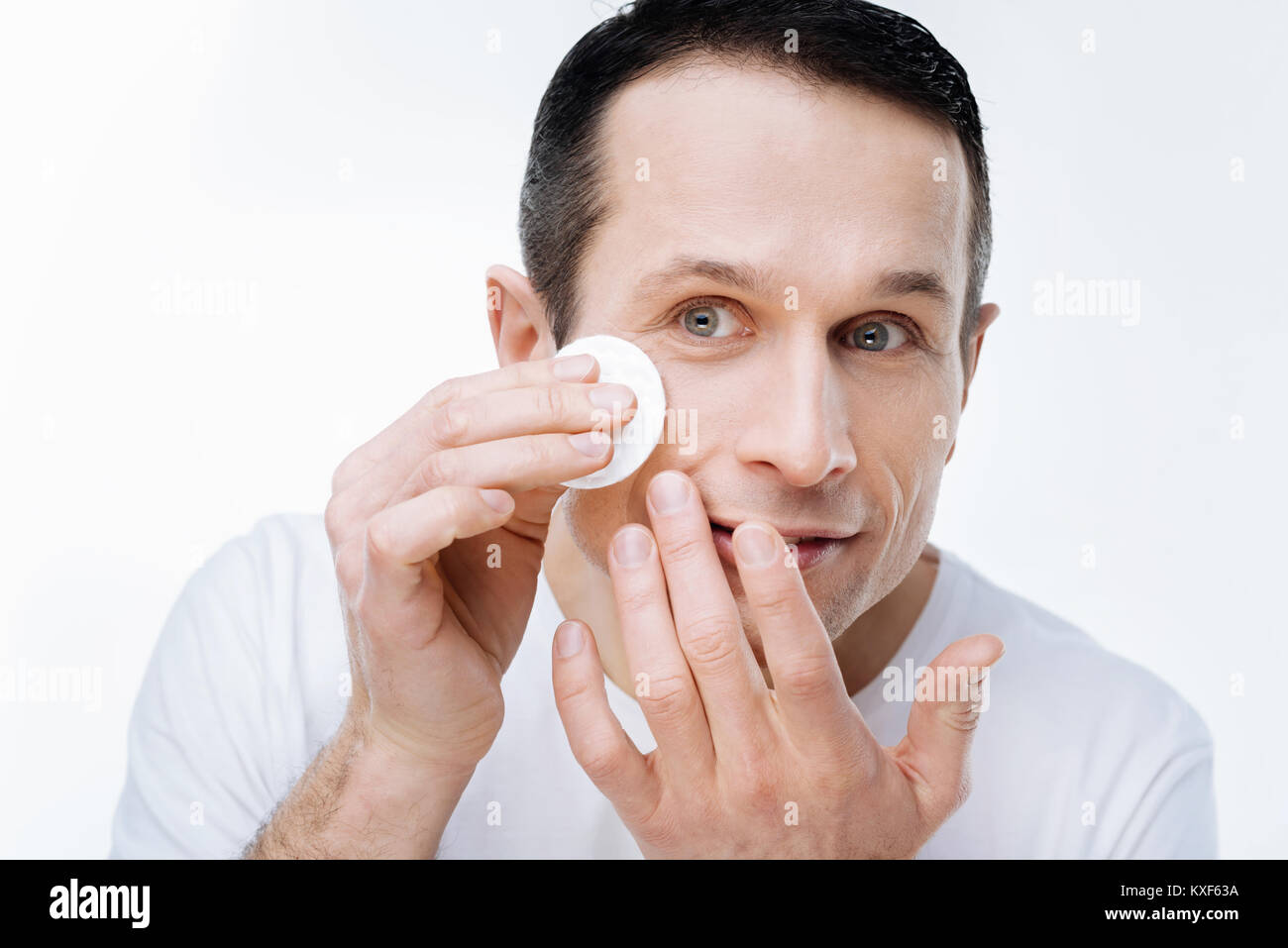 Nice handsome man caring about his skin Stock Photo - Alamy