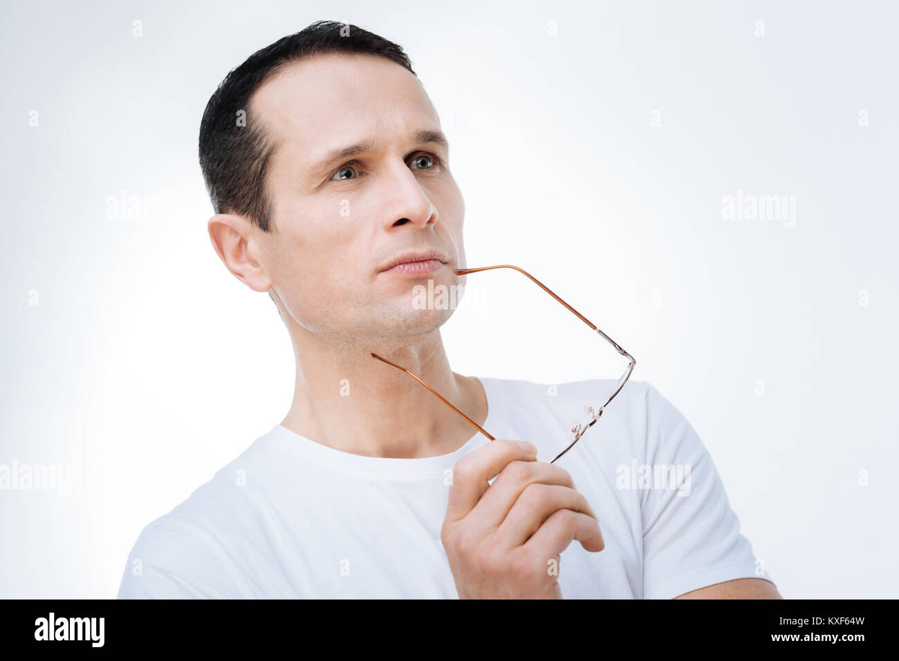 Serious smart man looking for a solution to a problem Stock Photo - Alamy