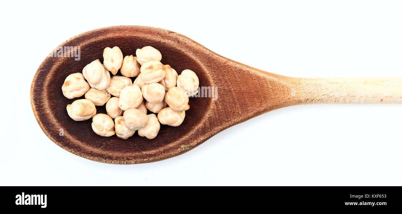Raw chick peas in a wooden spoon on white background Stock Photo - Alamy