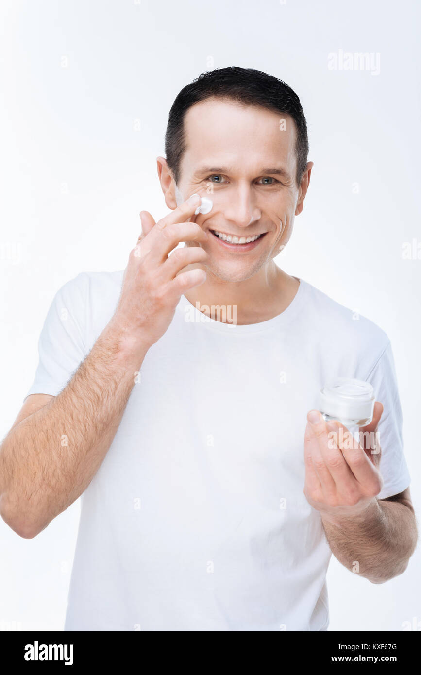 Happy positive man wanting to look handsome Stock Photo - Alamy