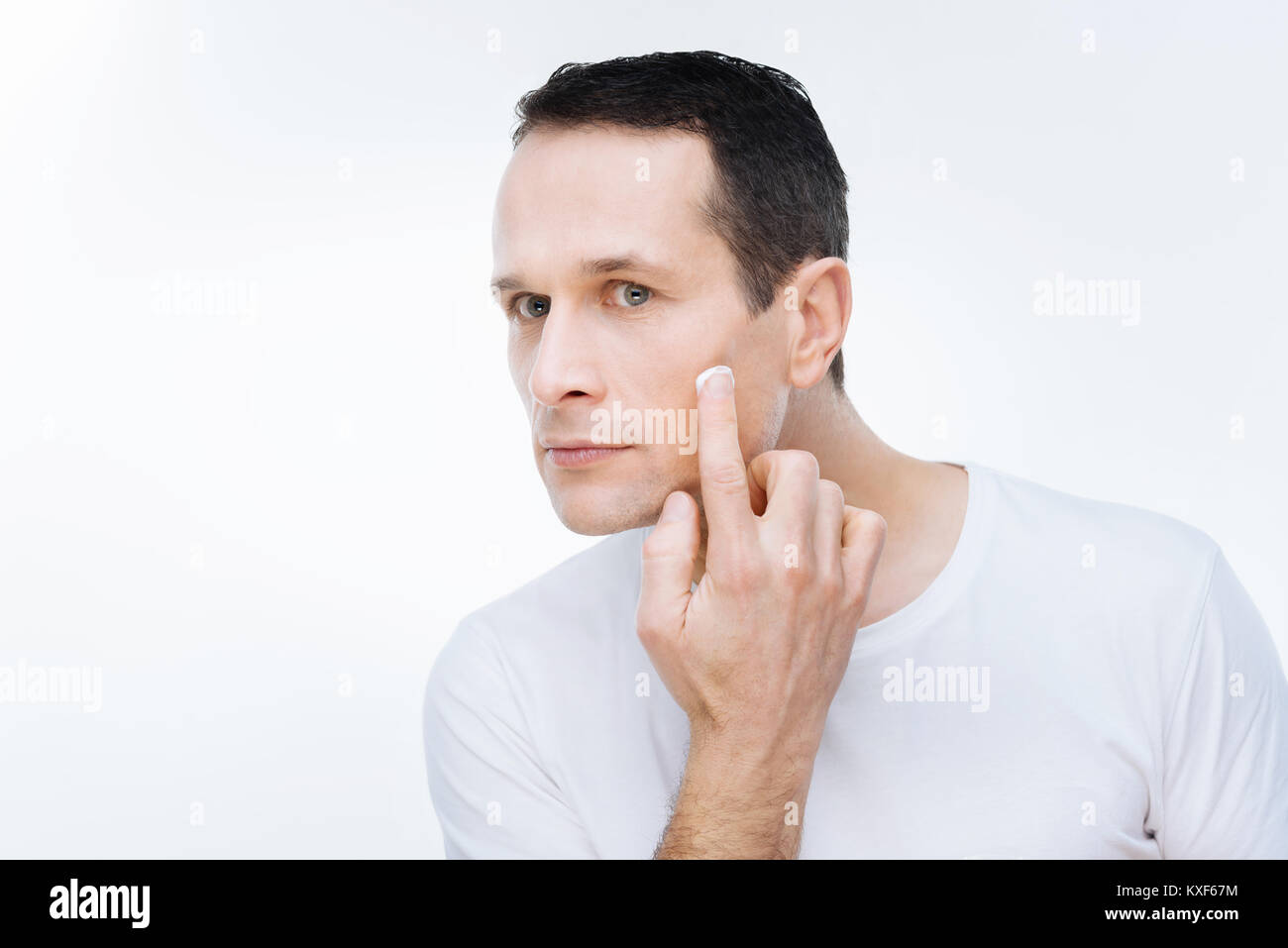 Handsome man touching smooth hi-res stock photography and images - Alamy