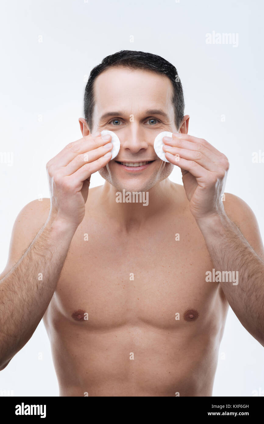 Cheerful nice man smiling Stock Photo - Alamy