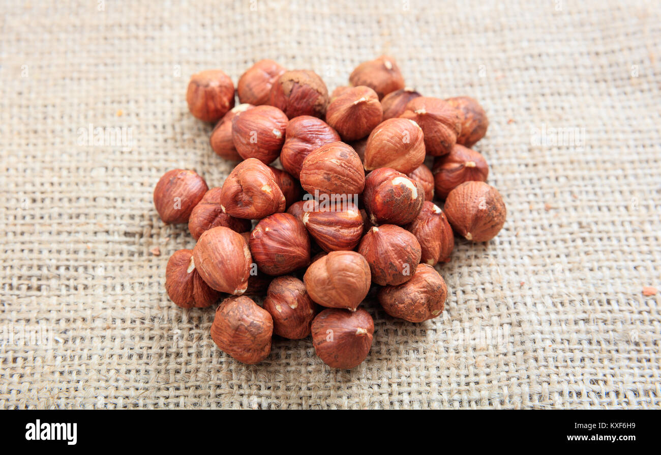 Peeled hazelnuts on a burlap Stock Photo - Alamy