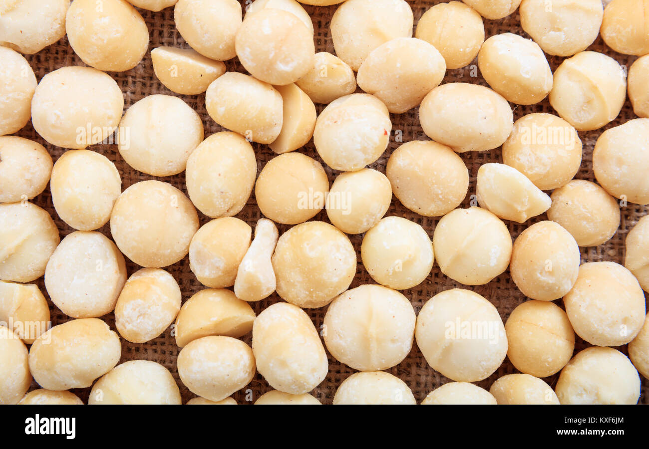 Macadamia nuts full background Stock Photo - Alamy
