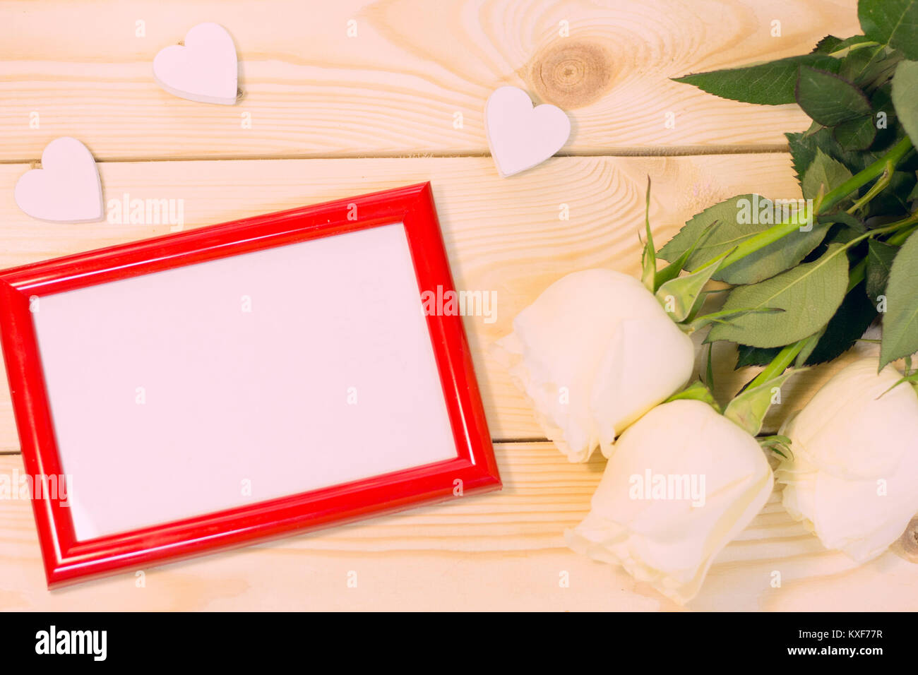White roses on natural wooden background Stock Photo - Alamy