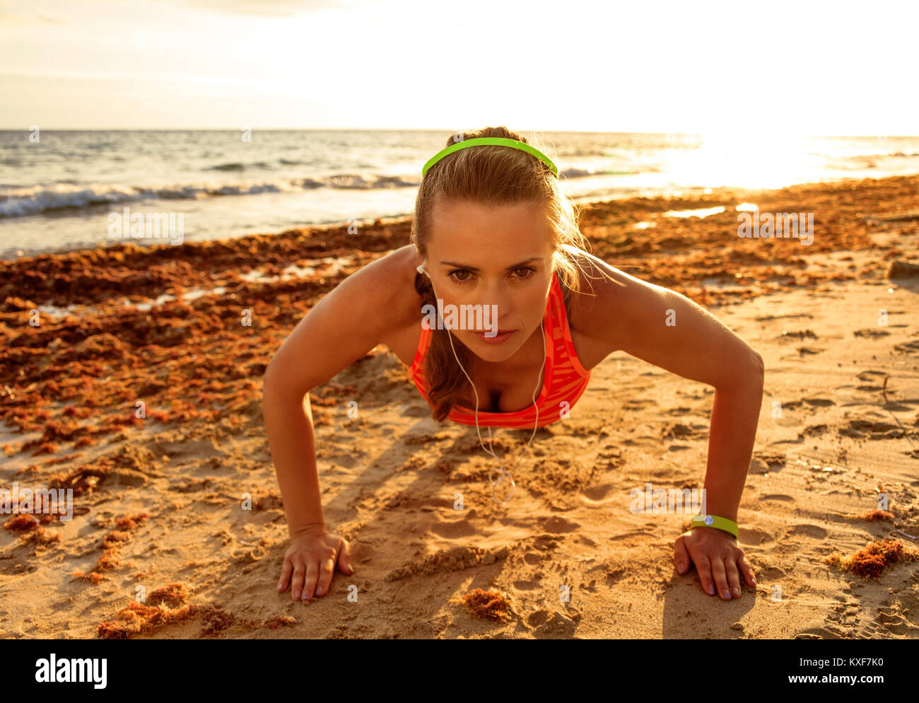 Refreshing wild sea side workout. active fitness woman in sportswear on ...