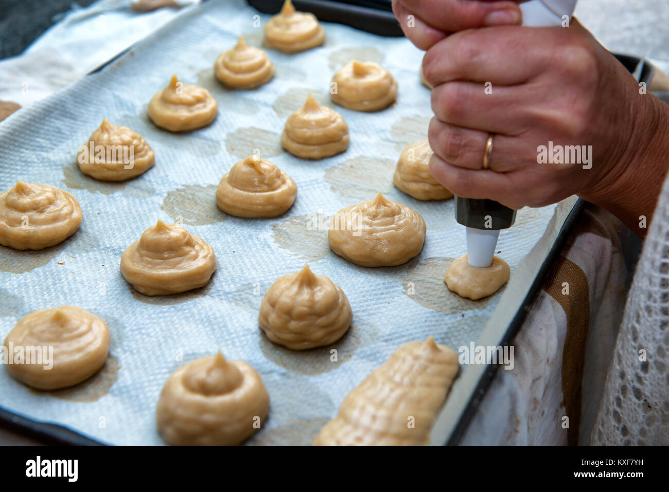 a preparation of small cream puffs Stock Photo - Alamy