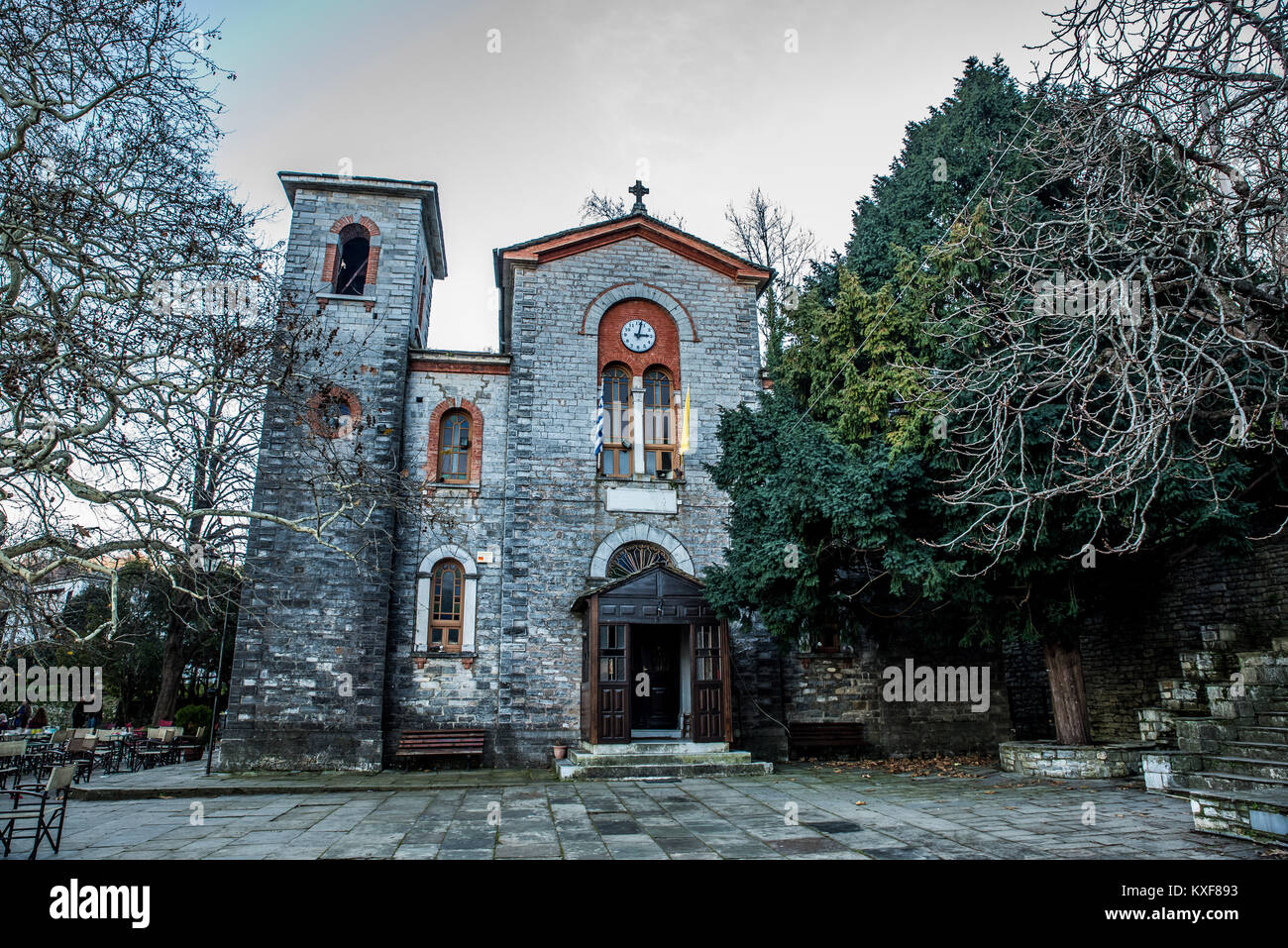 Tsagarada main square with Agia Paraskevi church, on a sunny winter ...