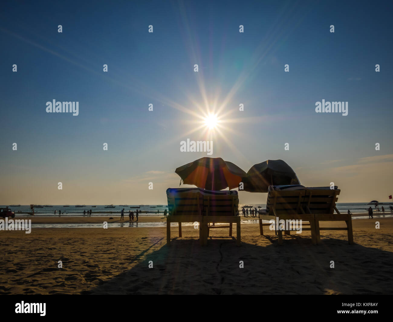 Goa, India - December, 21 2017 : Beach bed with umbrella with sun ...