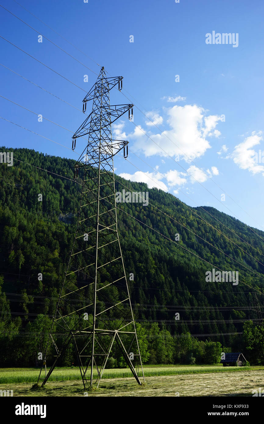 Pylon on the field in valley near mountain in Austria Stock Photo - Alamy