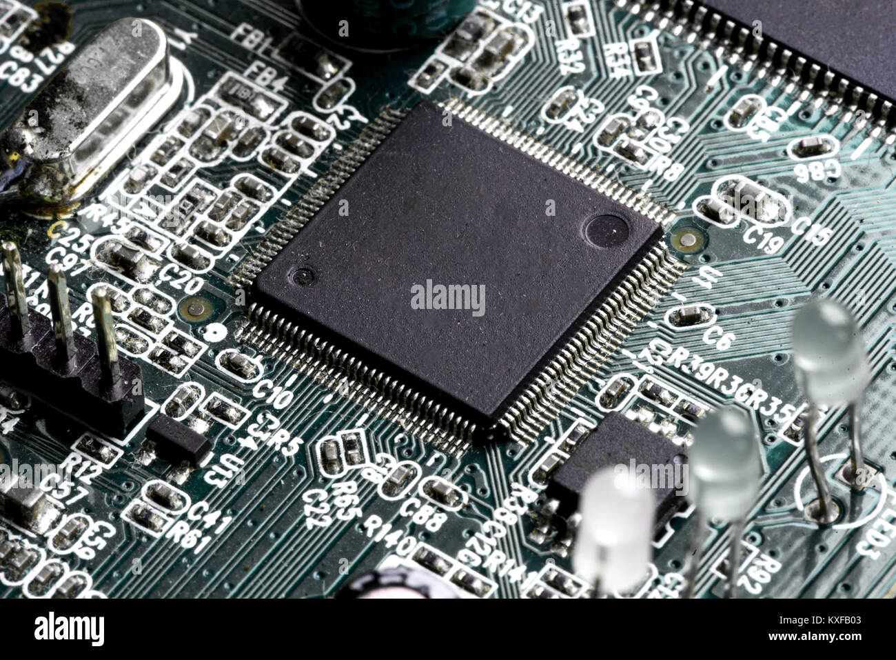 Electronic PCB printed circuit board in macro close-up with transistors ...
