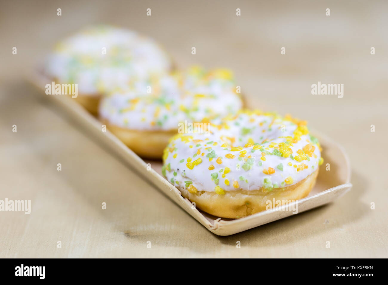 Tasty and fresh donuts on the kitchen table. Cookies, tasty snacks on a ...