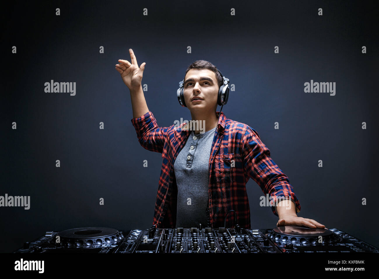 Closeup portrait of confident young DJ with stylish haircut and ...