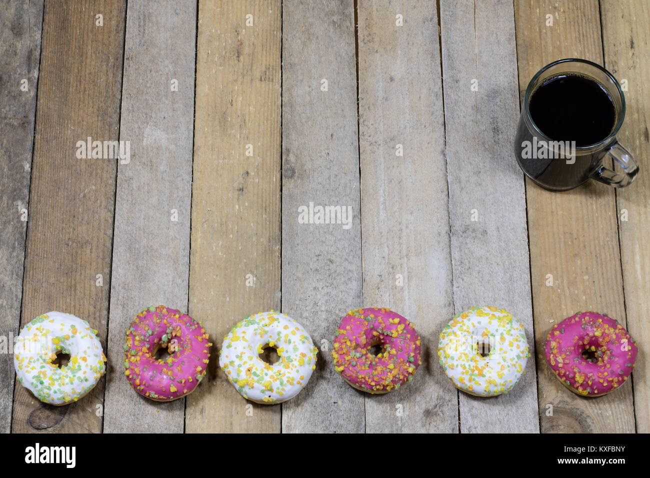 Tasty and fresh donuts on the kitchen table. Cookies, tasty snacks on a ...