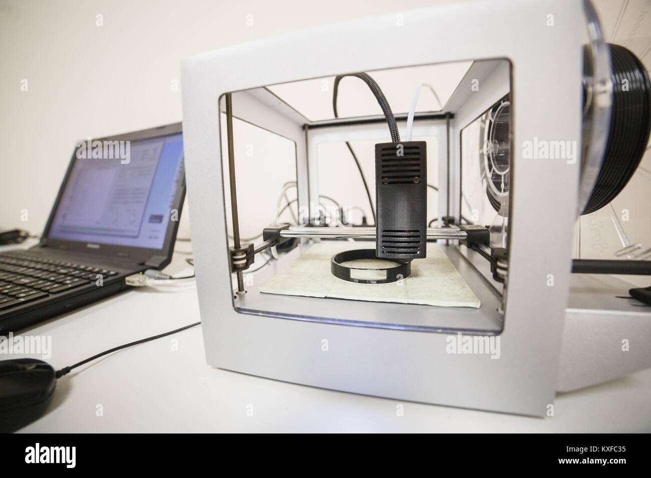 Electronic three dimensional plastic printer during work in laboratory ...