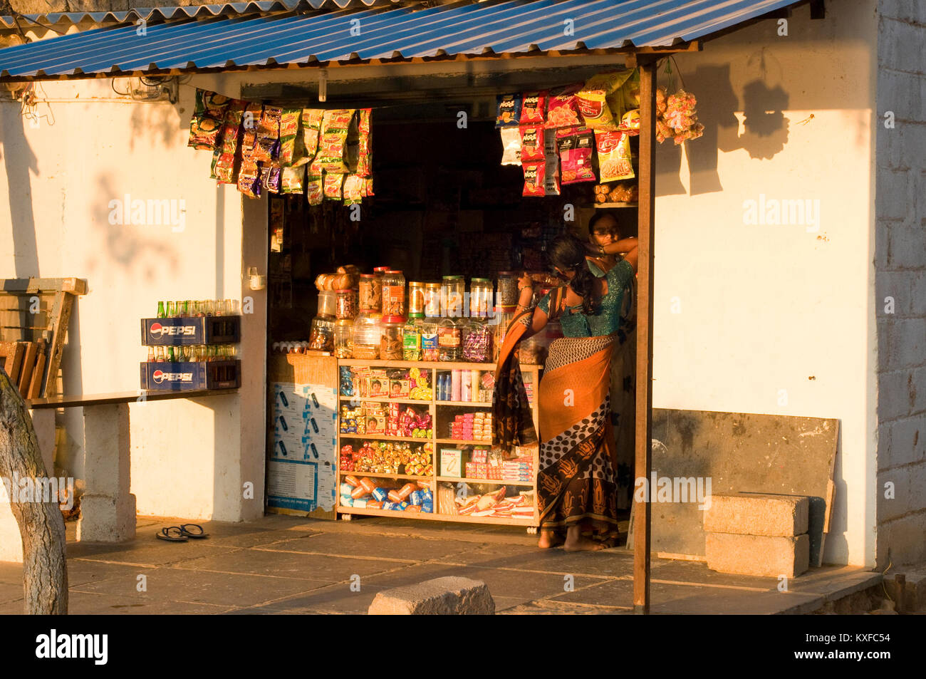 Shop kiosk front in India at sunrise Stock Photo - Alamy
