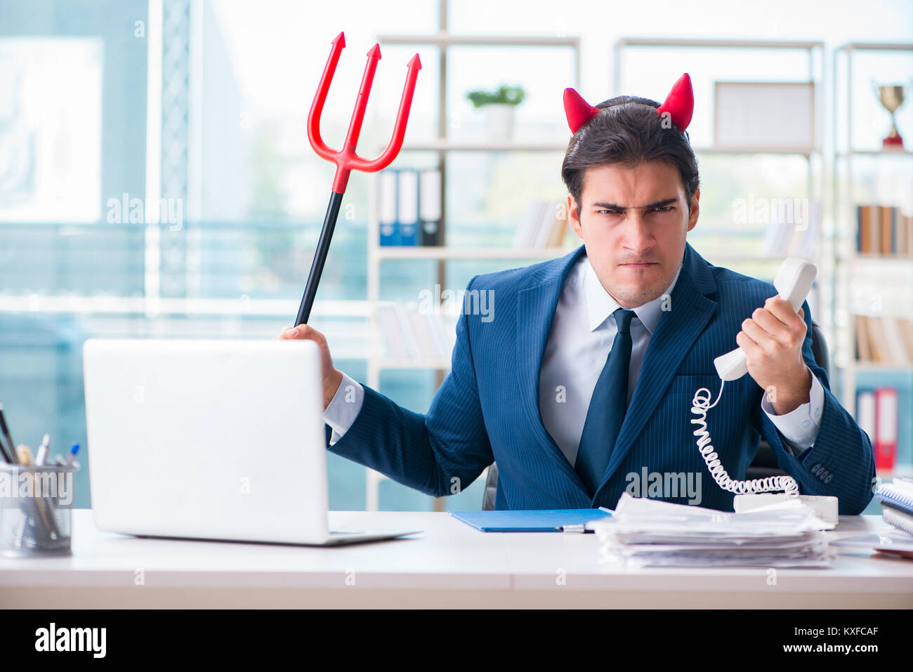 Devil angry businessman in the office Stock Photo - Alamy