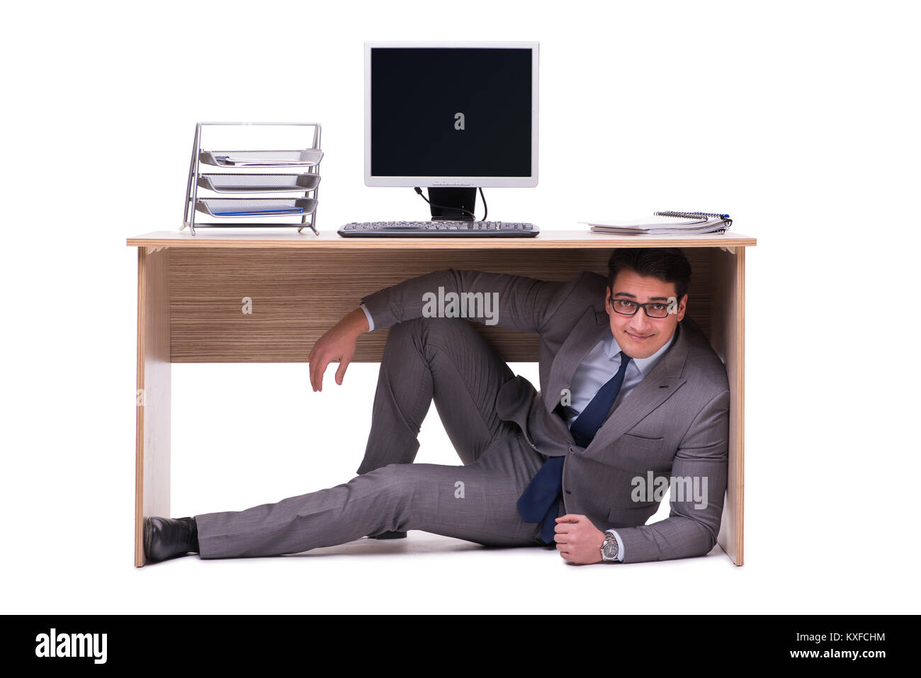 Businessman hiding in the ofice Stock Photo - Alamy