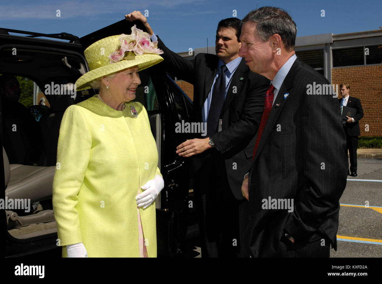 Queen Elizabeth II, left, is greeted by NASA Administrator Michael ...