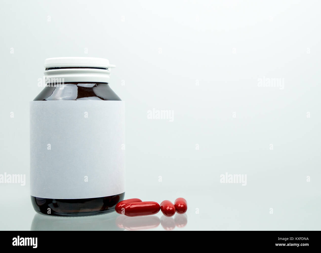 Macro shot of red multivitamins capsule pills for pregnant woman with ...