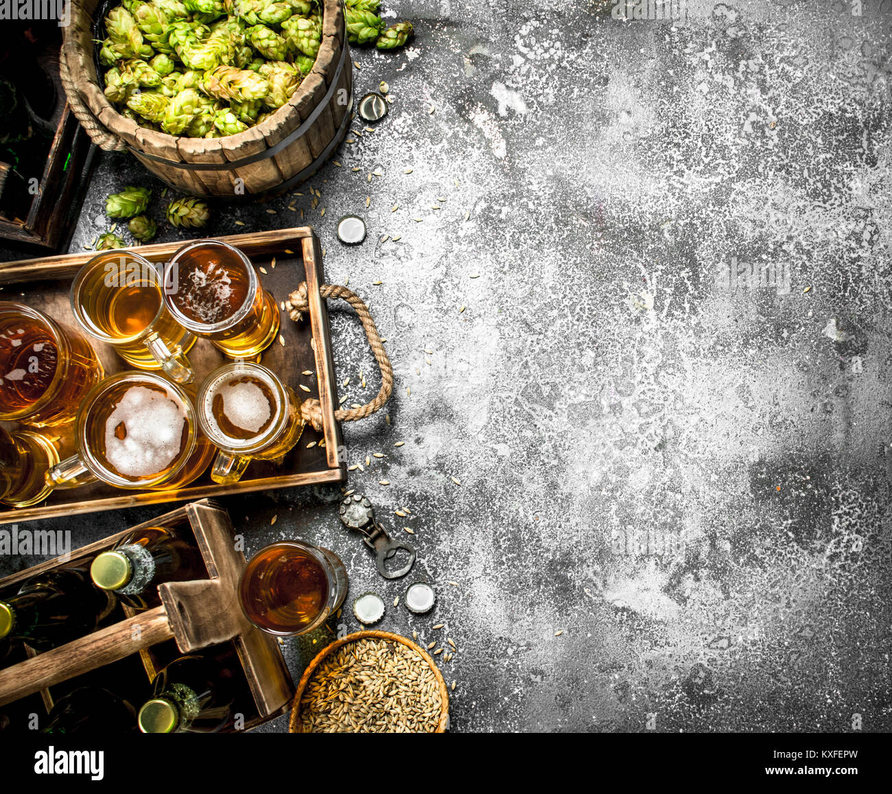 Beer background. Fresh beer with ingredients. On a rustic background ...