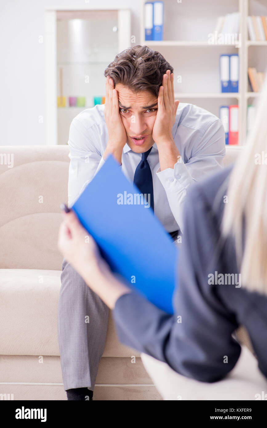 Young man visiting psychiatrist doctor for consultation Stock Photo - Alamy