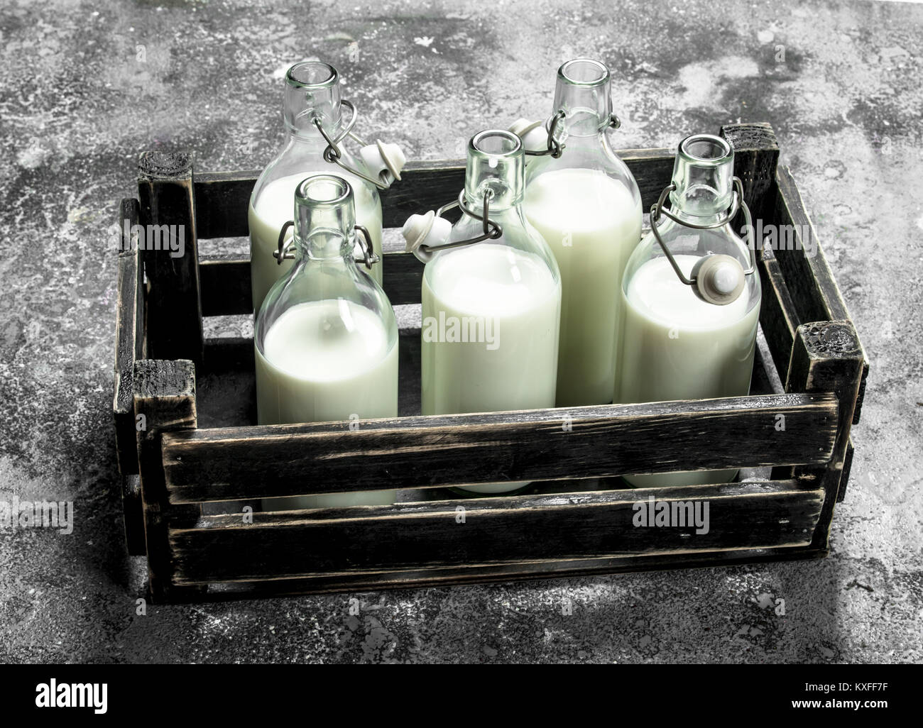Fresh milk in an old box. On a rustic background Stock Photo - Alamy