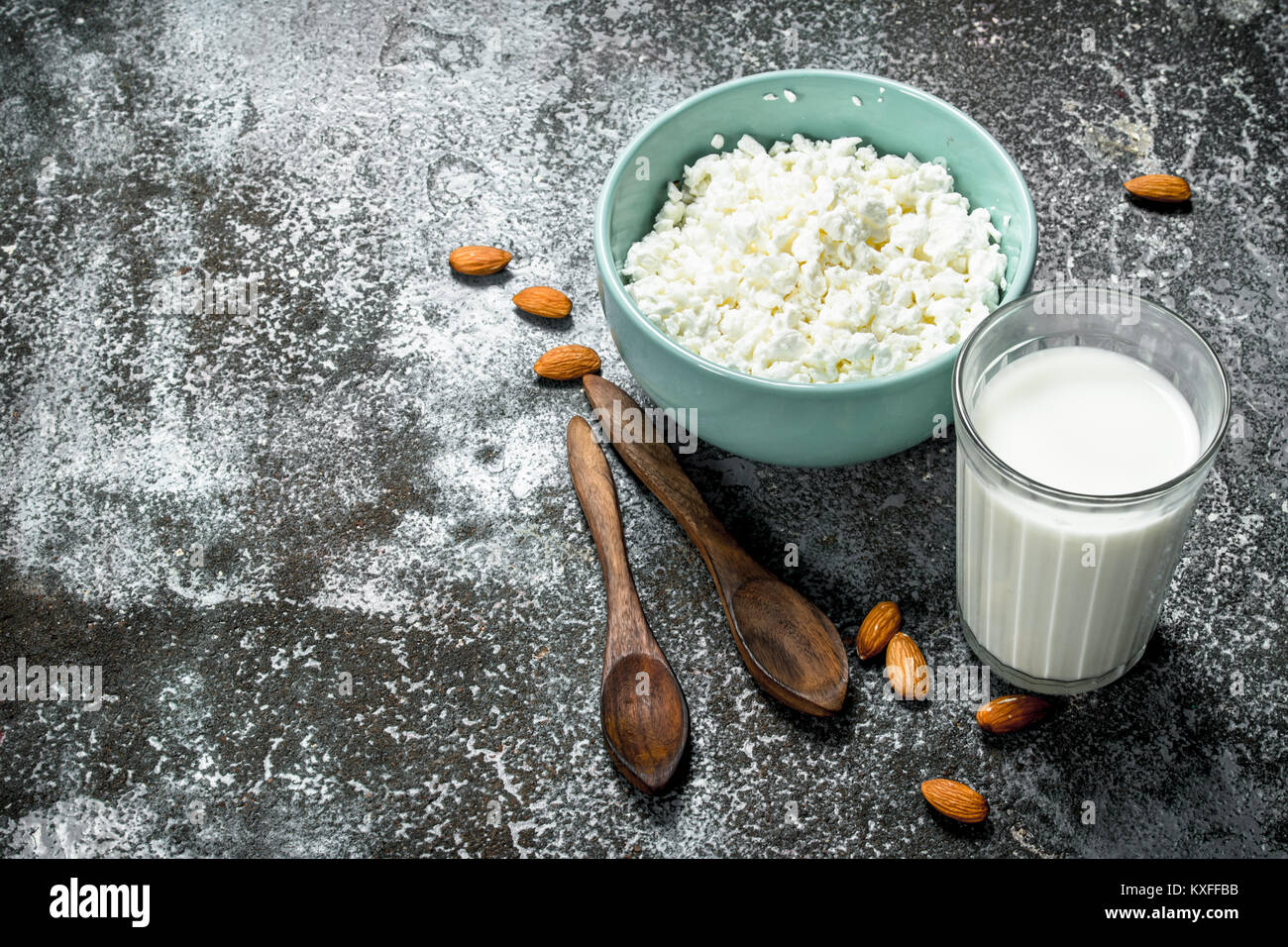 Cottage cheese and natural cow milk. On a rustic background Stock Photo ...