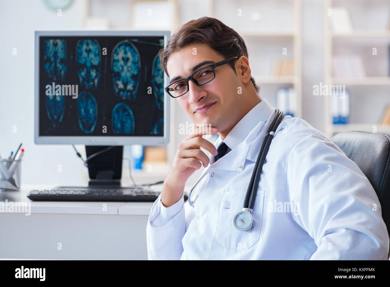 Doctor radiologist looking at x-ray images Stock Photo - Alamy