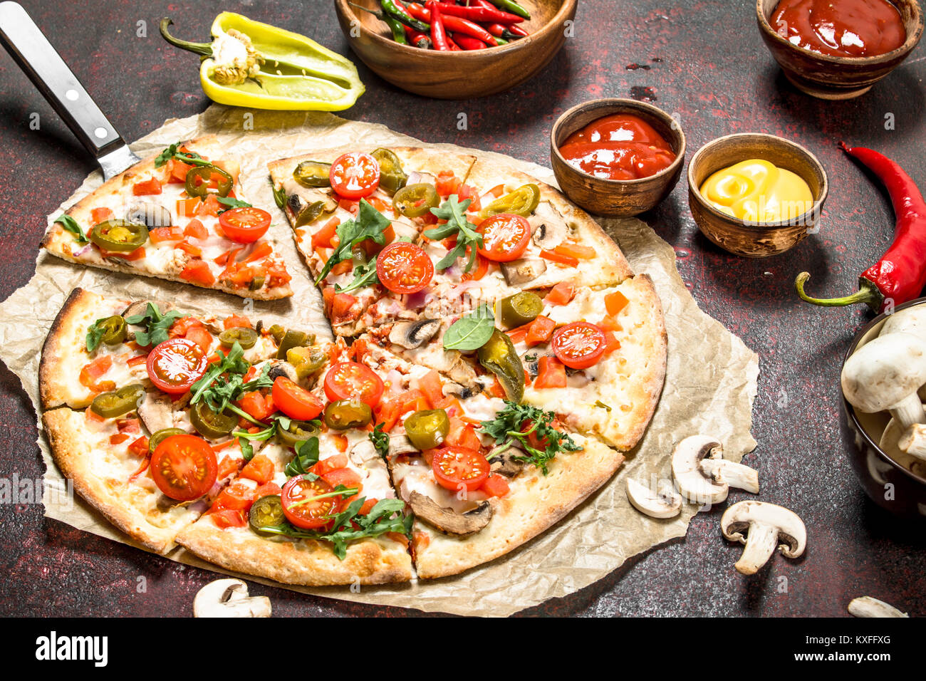 Mexican pizza with hot pepper. On a rustic background Stock Photo - Alamy