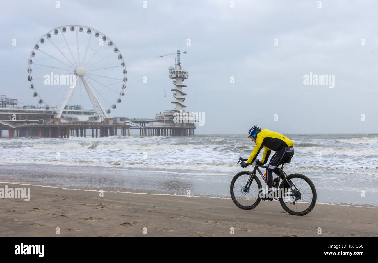 Scheveningen, The Netherlands - 30 December 2017: Cyclist on the beach ...