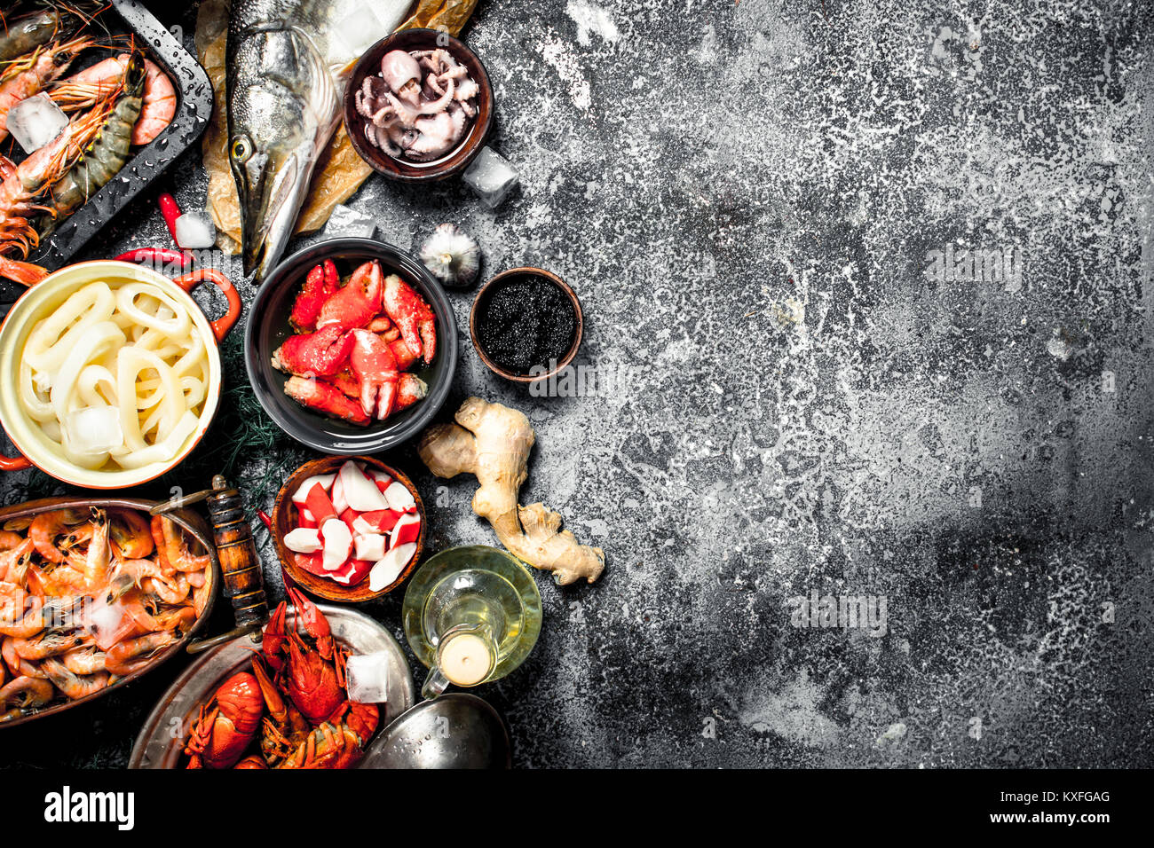 Different fresh seafood. On a rustic background Stock Photo - Alamy