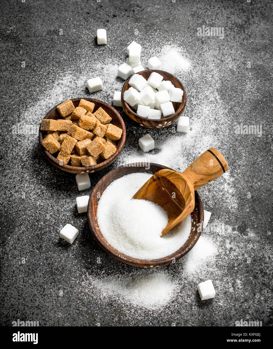 Different kinds of sugar in bowls. On a rustic background Stock Photo ...