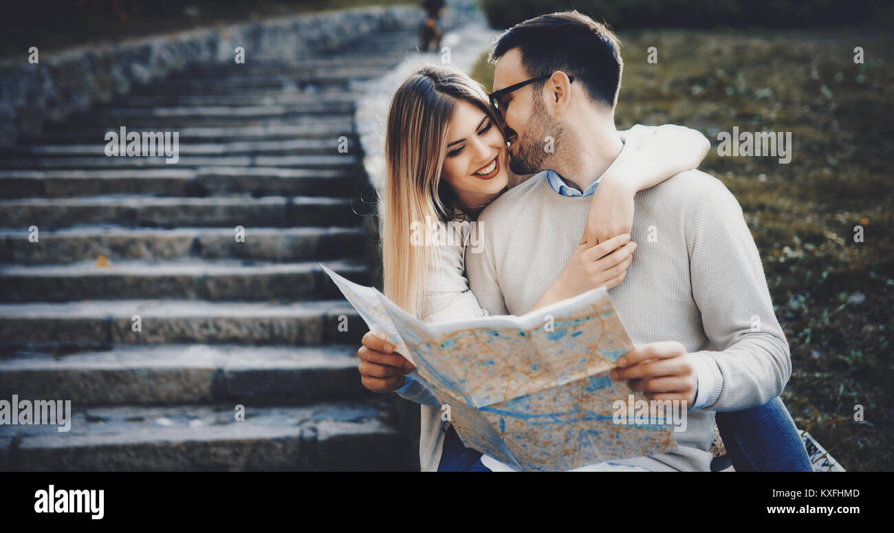 Tourist couple using map as guide Stock Photo - Alamy