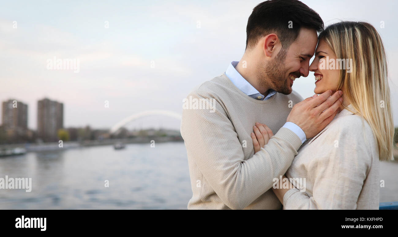 Happy couple smiling and dating outdoor Stock Photo - Alamy