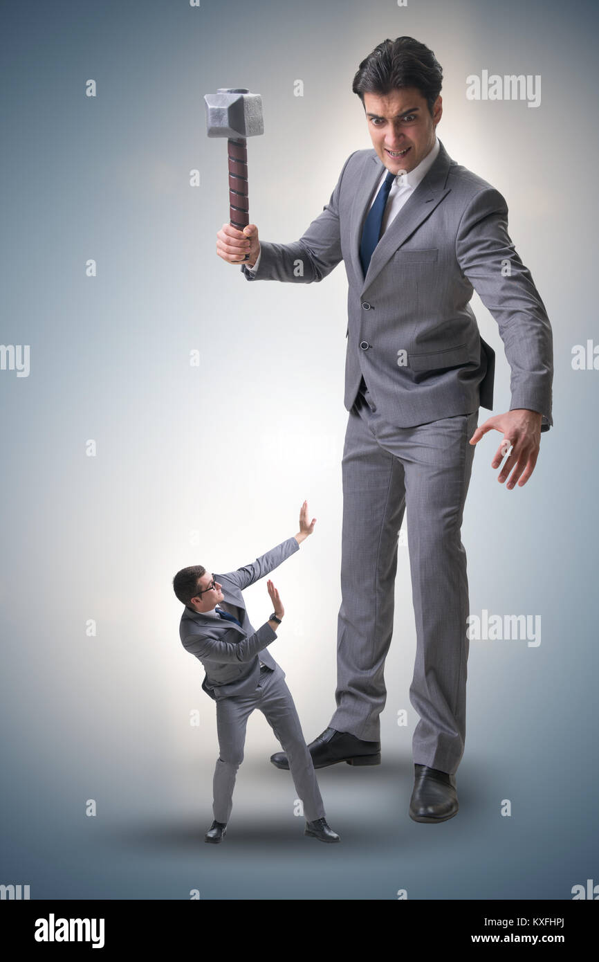 Bad angry boss threatening employee with hammer Stock Photo - Alamy