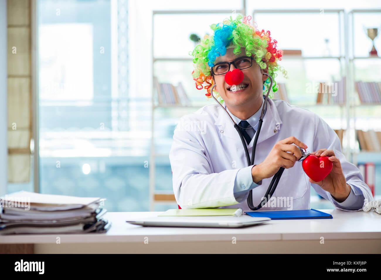 Child cardiologist with stethoscope and red heart Stock Photo - Alamy