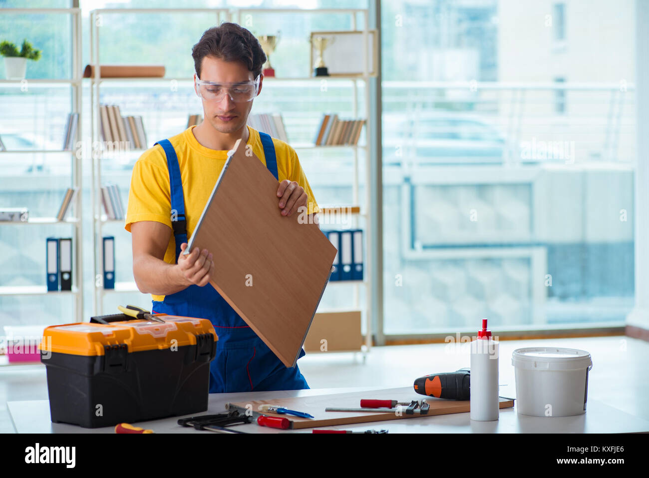 Furniture carpenter working in the workshop Stock Photo - Alamy