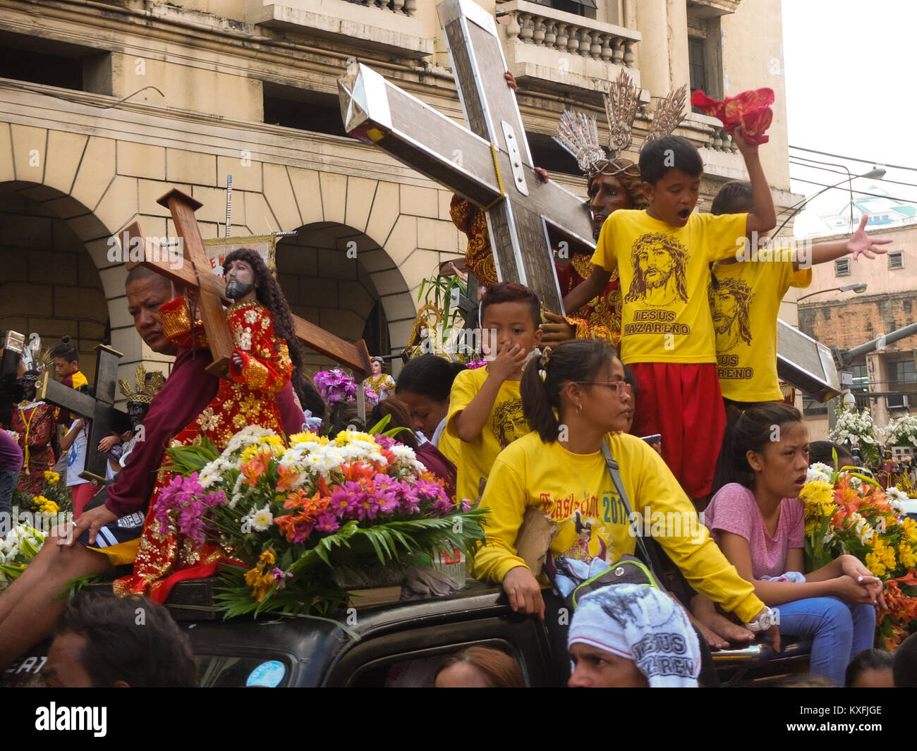 A child throwing a Nazarene handkerchief after wiping it on their own ...