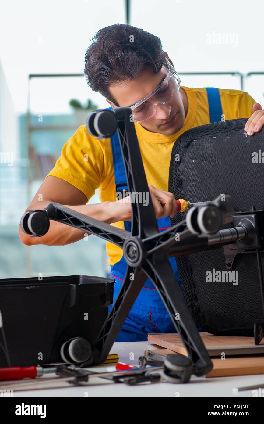 Furniture repairman working on repairing the chair Stock Photo - Alamy