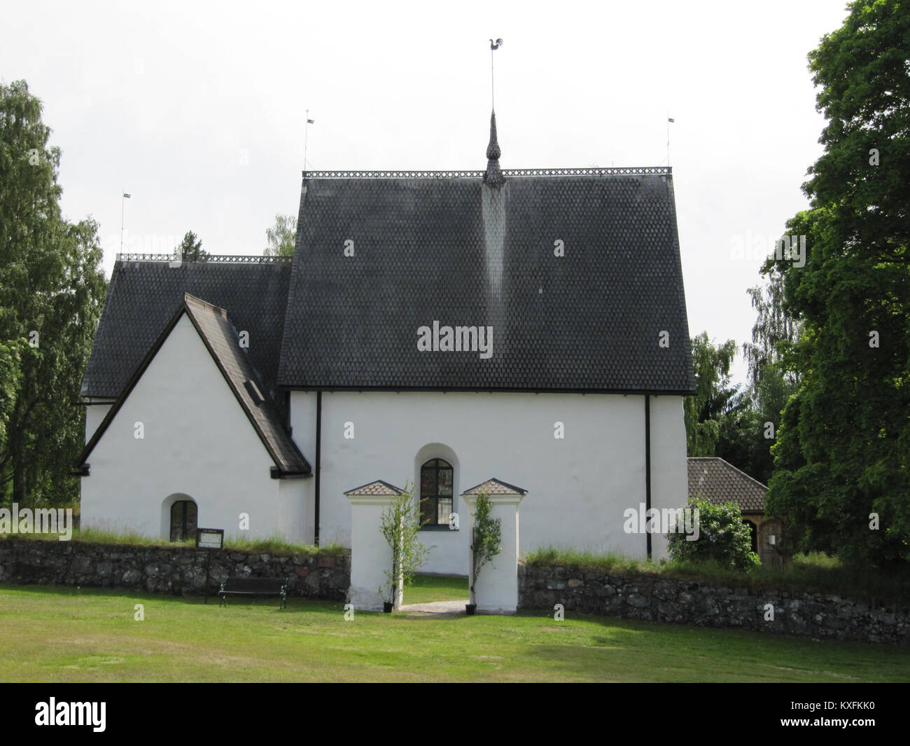 Exterior view of the Old Church of Alnö showing its whitewashed stone ...