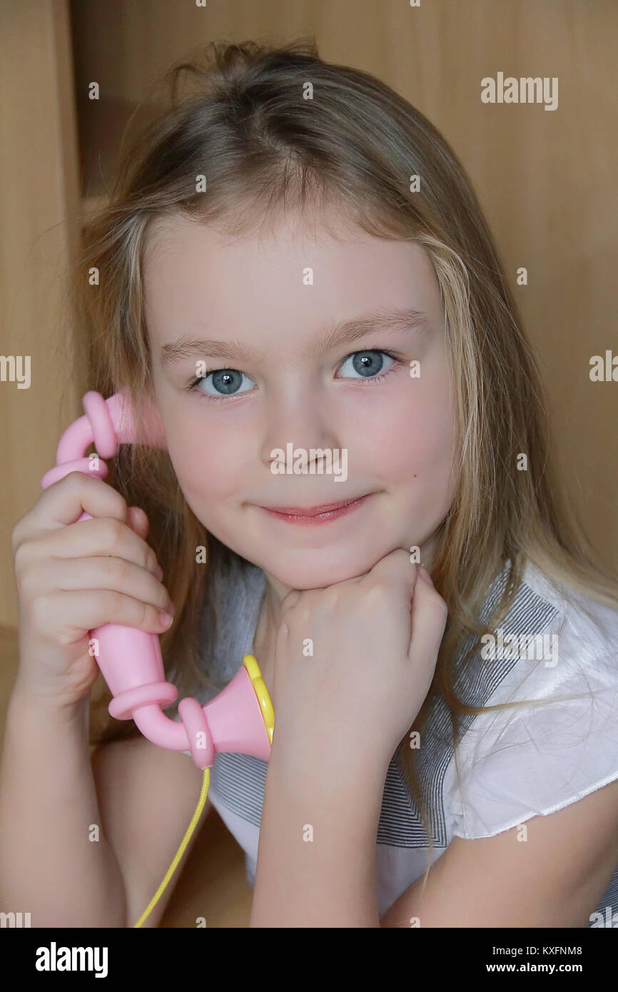 Portrait of beautiful girl with pink telephone Stock Photo - Alamy