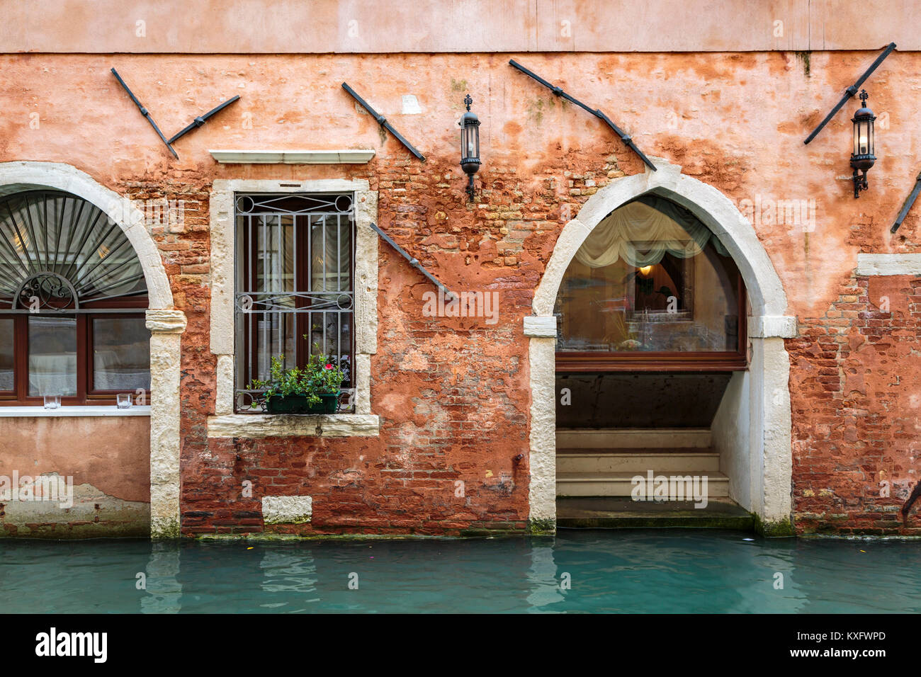 A building detail and canal in Veneto, Venice, Italy, Europe Stock ...